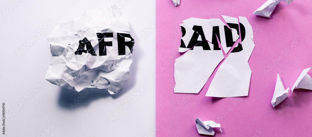 Cut and Crumpled pieces of paper with the word AFRAID. Stock Photo ...