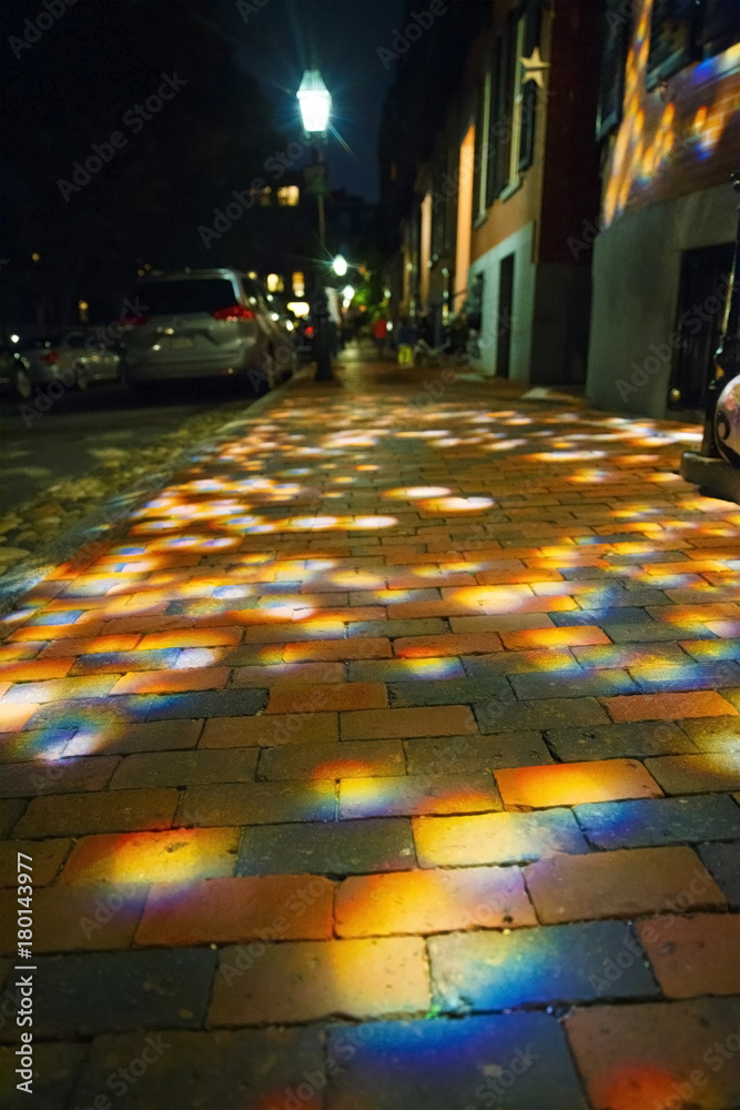 colorful glare on the sidewalk from the Christmas Illuminations ...