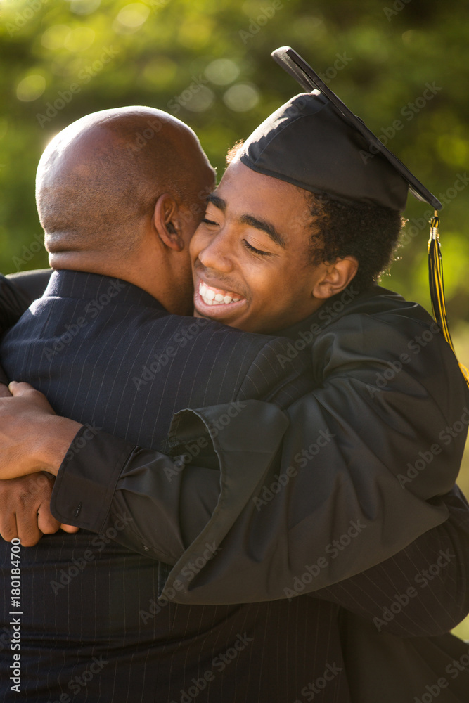 Father hugging his son at his graduation. Stock Photo | Adobe Stock