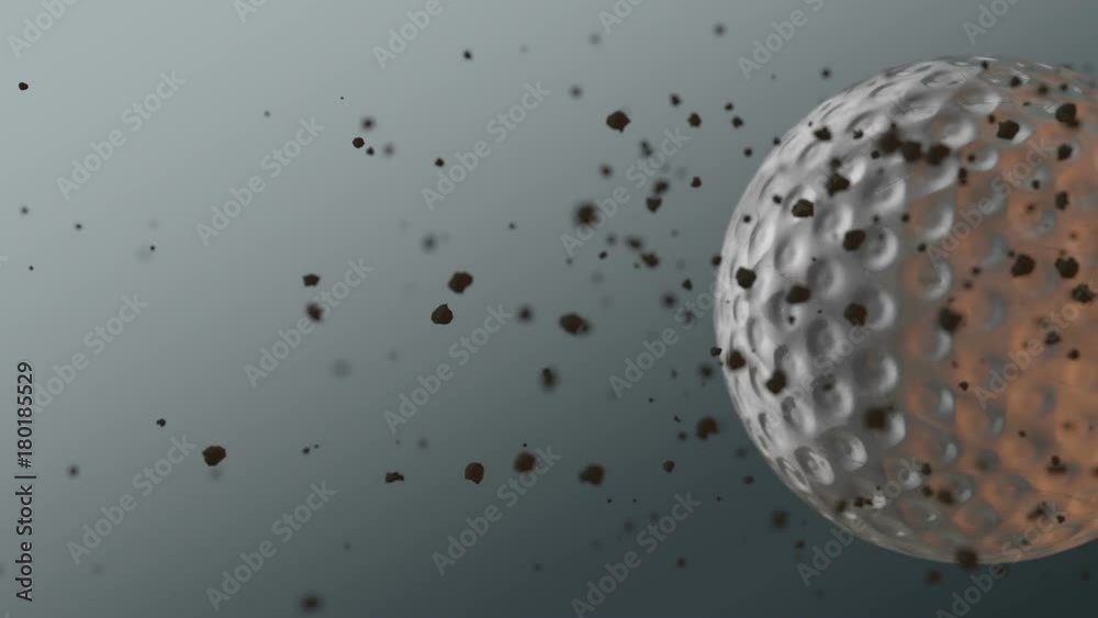 A dirty white golf ball caught spinning in slow motion flying through ...