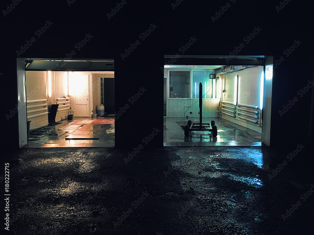 Car wash exterior in the night with yellow and blue lamps Stock Photo ...