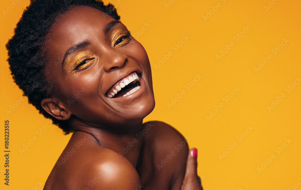 Cheerful female model with vivid makeup Stock Photo | Adobe Stock