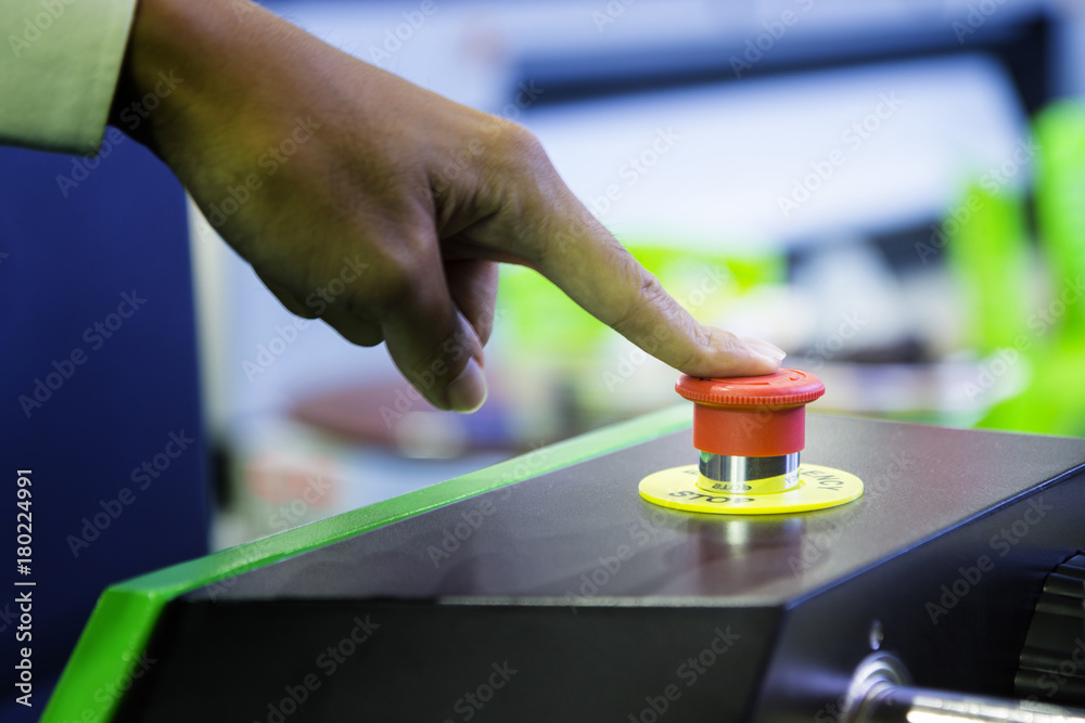 emergency stop button push by finger for stopping machine Stock Photo ...