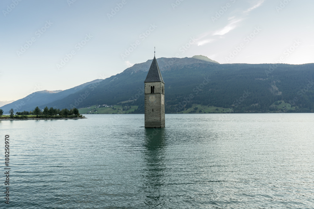 Church under water, drowned village, mountains landscape and peaks in ...
