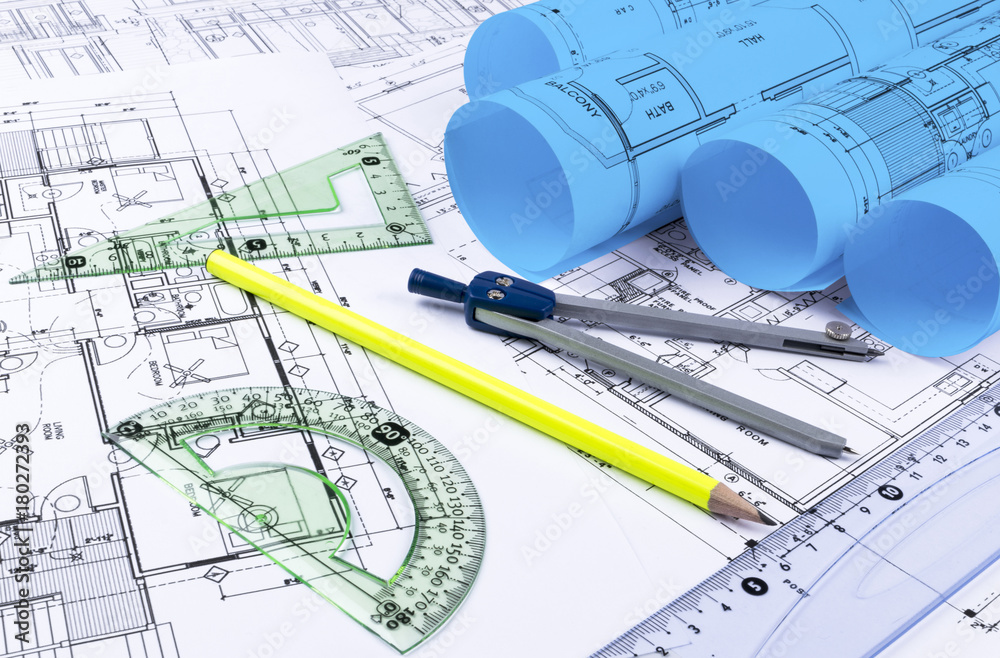 Architectural blueprints and blueprint rolls and a drawing instruments ...