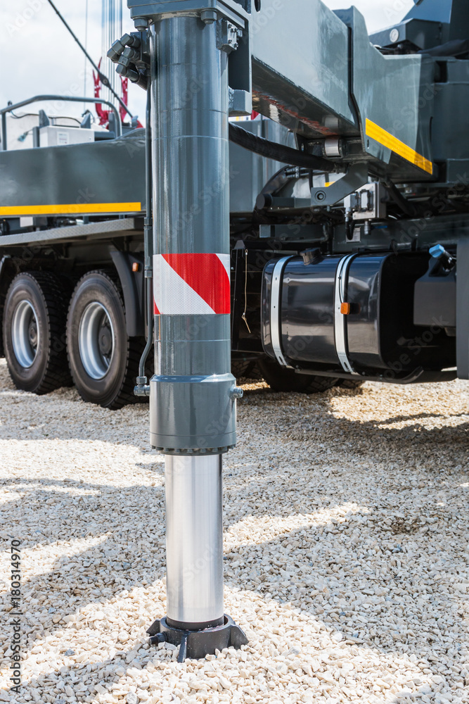 hydraulics crane support. hydraulics crane support is on gravel. focus ...