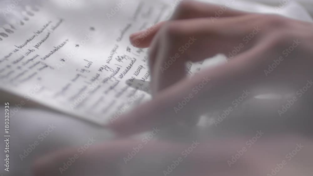 Close up of elegant hand of unrecognizable woman touching handwritten ...