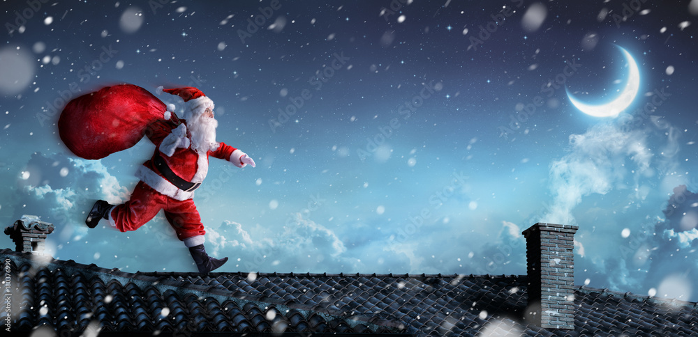 Santa Claus Running On The Rooftops Stock Photo | Adobe Stock