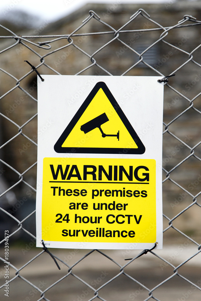 Warning Sign with 24 hour CCTV Surveillance attached to a perimeter ...
