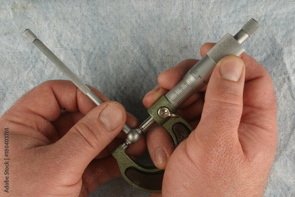 Metric Micrometer, telescoping gauge, blue shop towel background Stock ...
