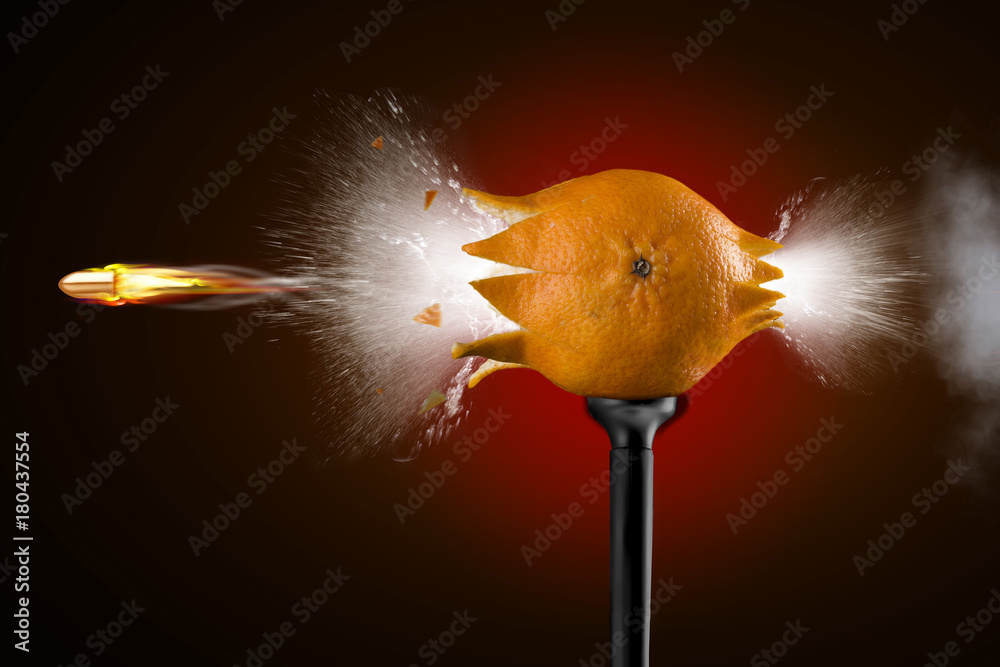 shot pistol tangerine spray splashes fire smoke black background sparks ...