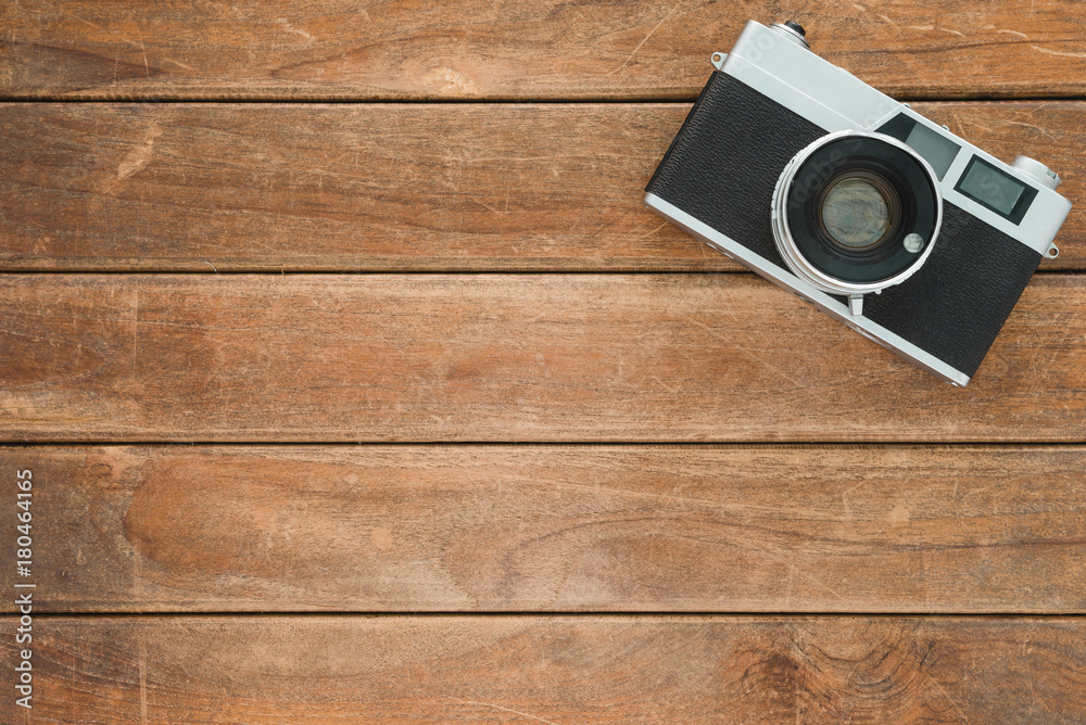 Office desk wooden table with old camera. Top view with copy space. Top ...