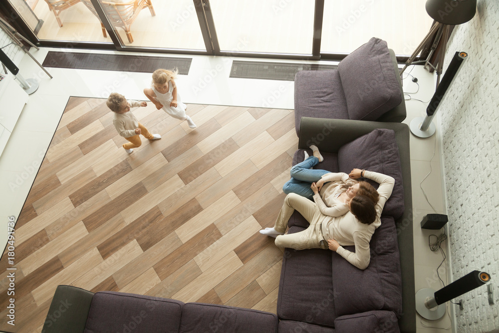 Kids playing little boy and girl running in cozy living room interior ...