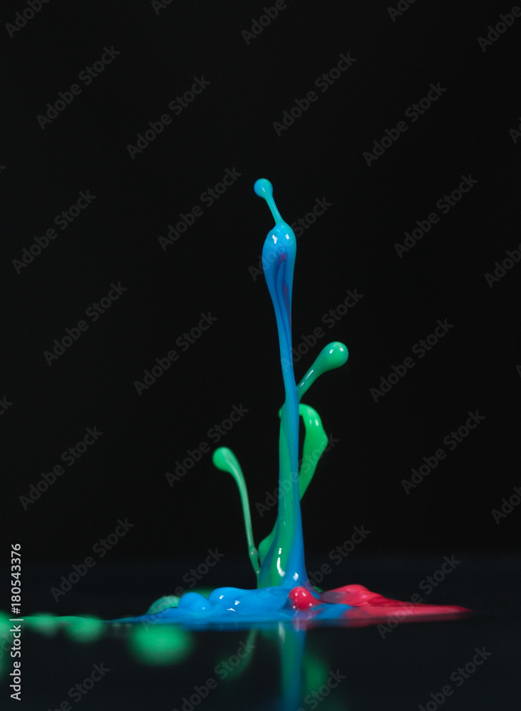 splashes of blue slime in ultraviolet light on a black background Stock ...