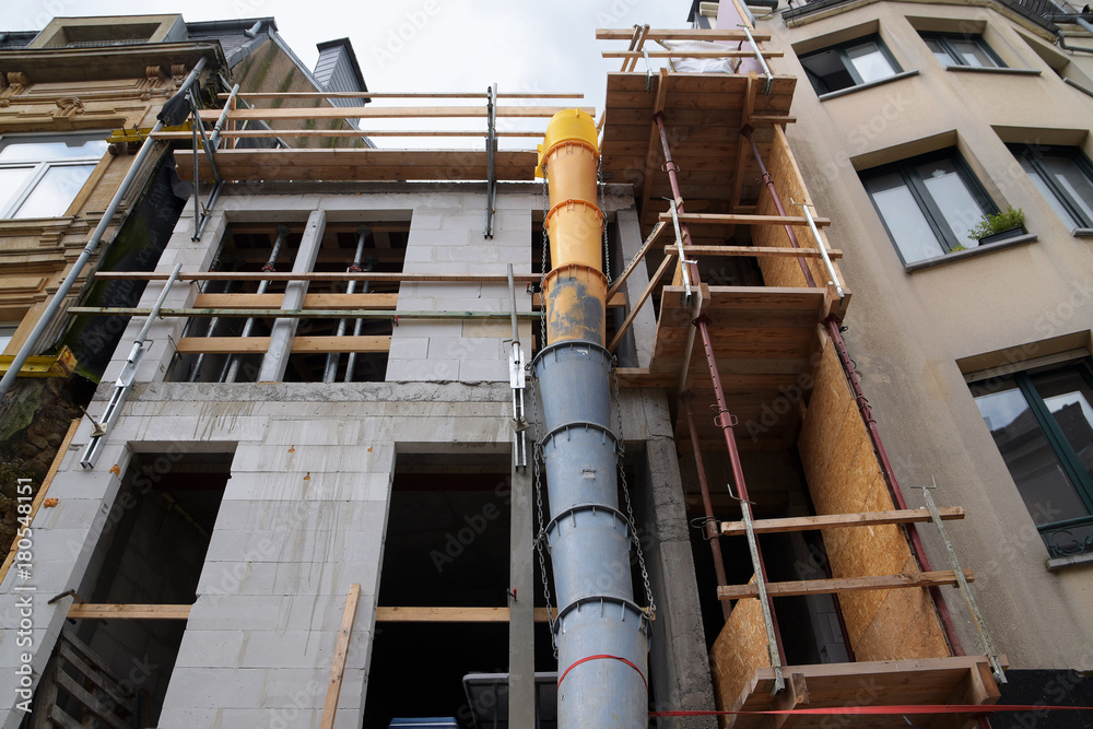 construction site in an old town gap, Scaffolding modular slide for ...