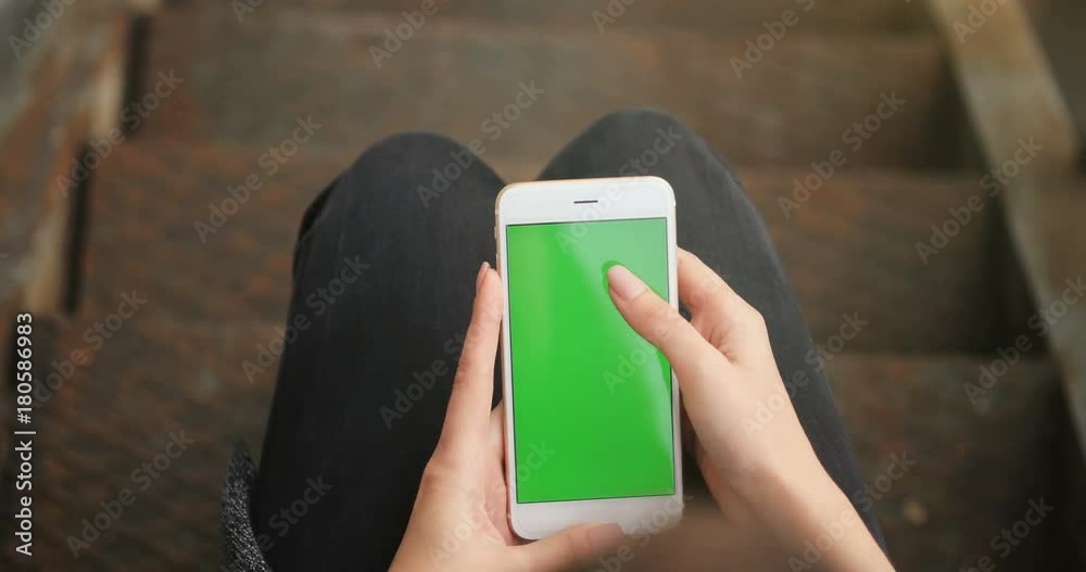 closeup girl woman using smart phone green screen chroma key swapping ...