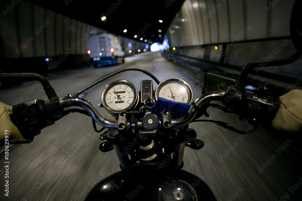 POV shot from drivers seat on motorcycle while passing through busy ...