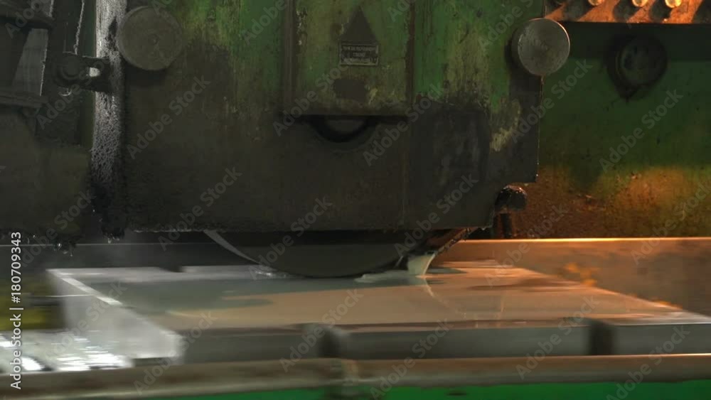 An original moving machine device polishes some metal surface with a ...