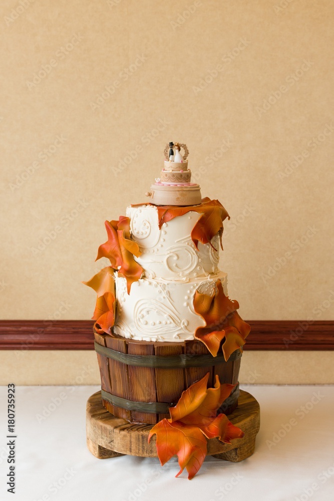 Fall 3 tier wedding cake with edible wood and leaf accents Stock Photo ...
