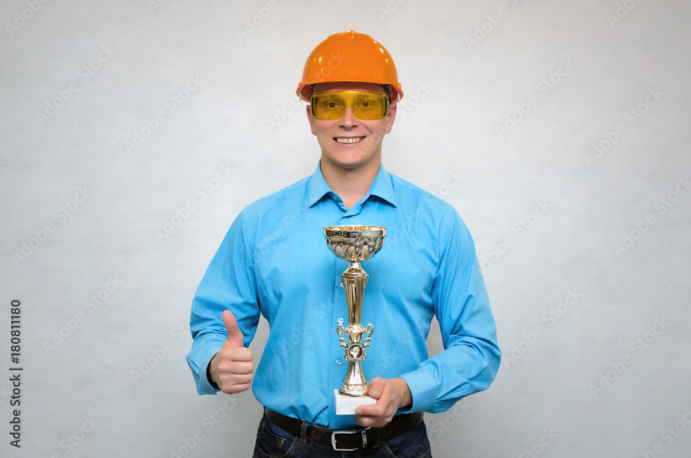 Builder award. Best construction worker. Builder in a hardhat holding ...