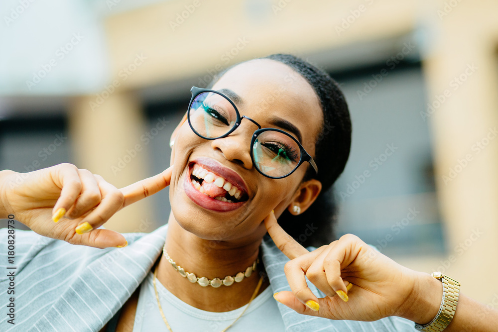 Goofy young teen african american woman student in eyeglasses making ...
