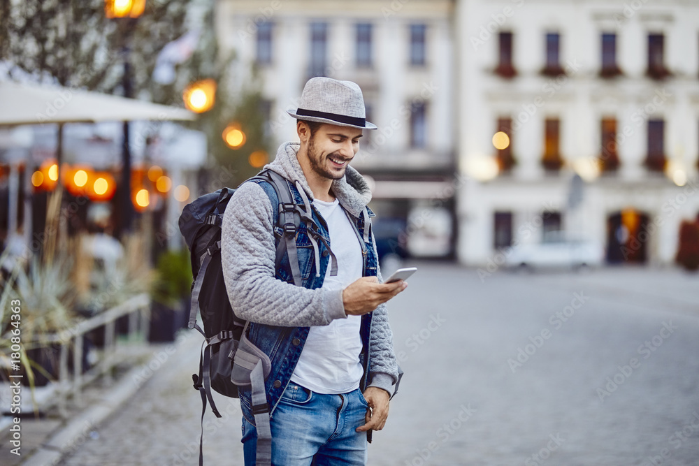 Tourist using phone while on vacation in the city Stock-Foto | Adobe Stock