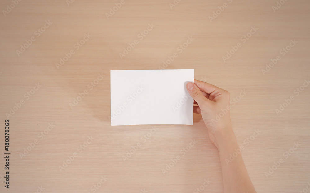 Hands holding blank white brochure booklet in the hand. Leaflet ...