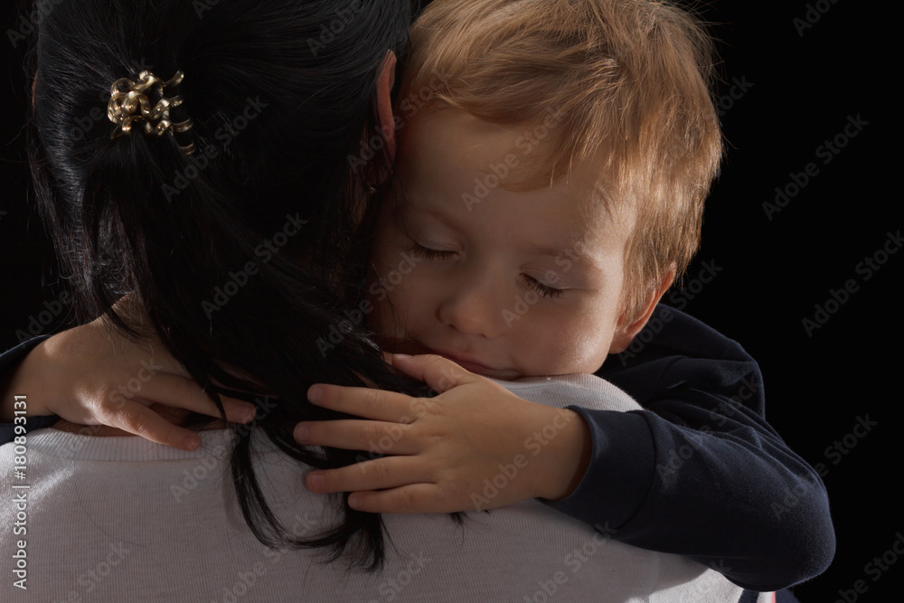 Adoption concept, an orphan is a little boy and his new mother. Happy ...