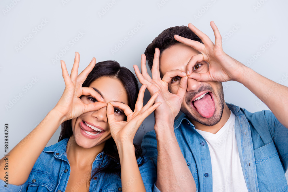 Concept of having funtime and grimacing, behaving like kids. Close up ...
