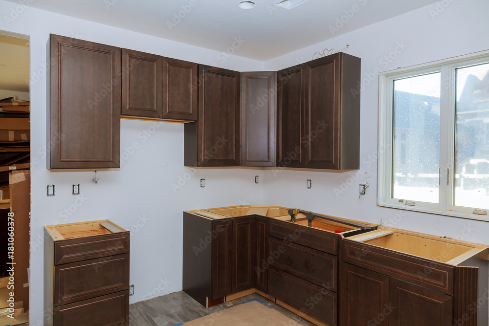 Custom kitchen cabinets in various stages of installation base for ...
