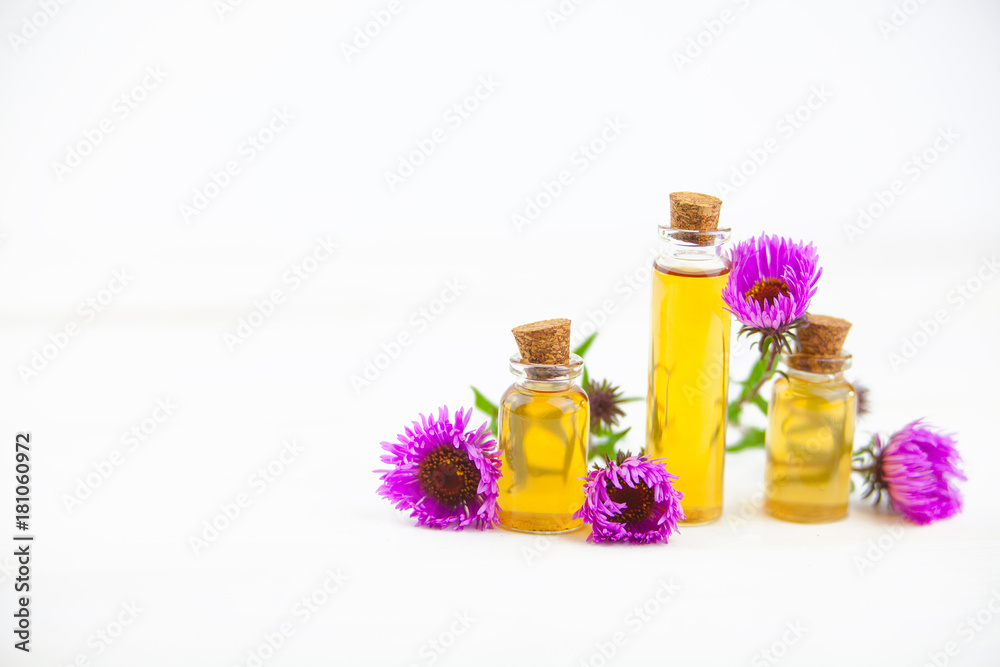Foto Stock aster essential oil in beautiful bottle on White background ...
