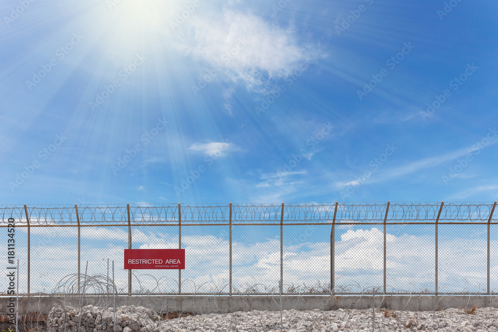 Restricted area fence and Passenger airplane landing beautiful blue sky ...