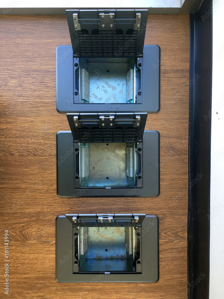 Floor plug,pop up plug in metal cover installed in wooden floor ...