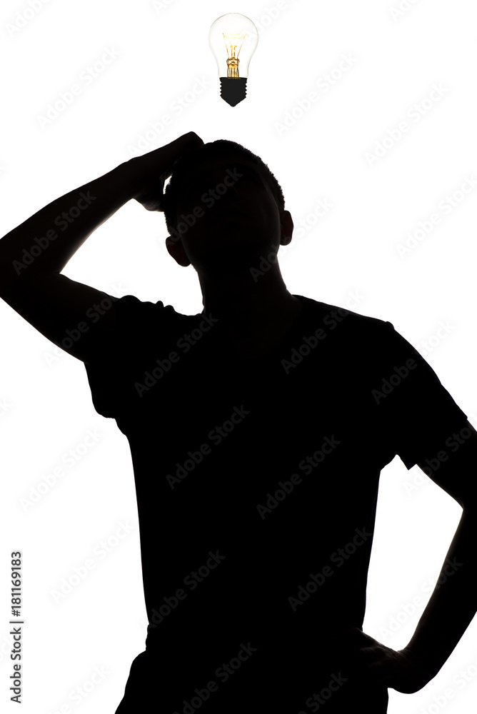 silhouette of an unknown man thinking how to solve the problem ...