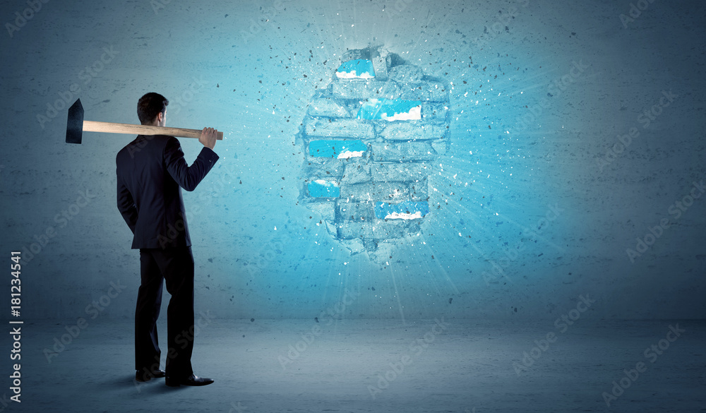 Business man hitting brick wall with huge hammer Stock Photo | Adobe Stock