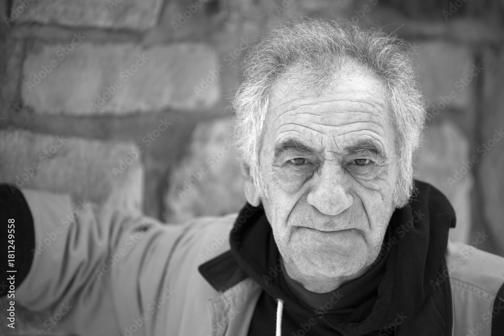 Black and white portrait of an handsome old man in his early seventy ...