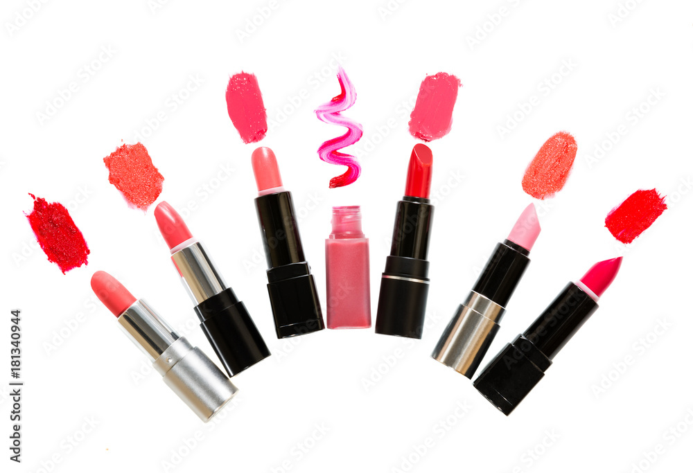 Six lipsticks in stickers and one in a tube with samples on a white ...