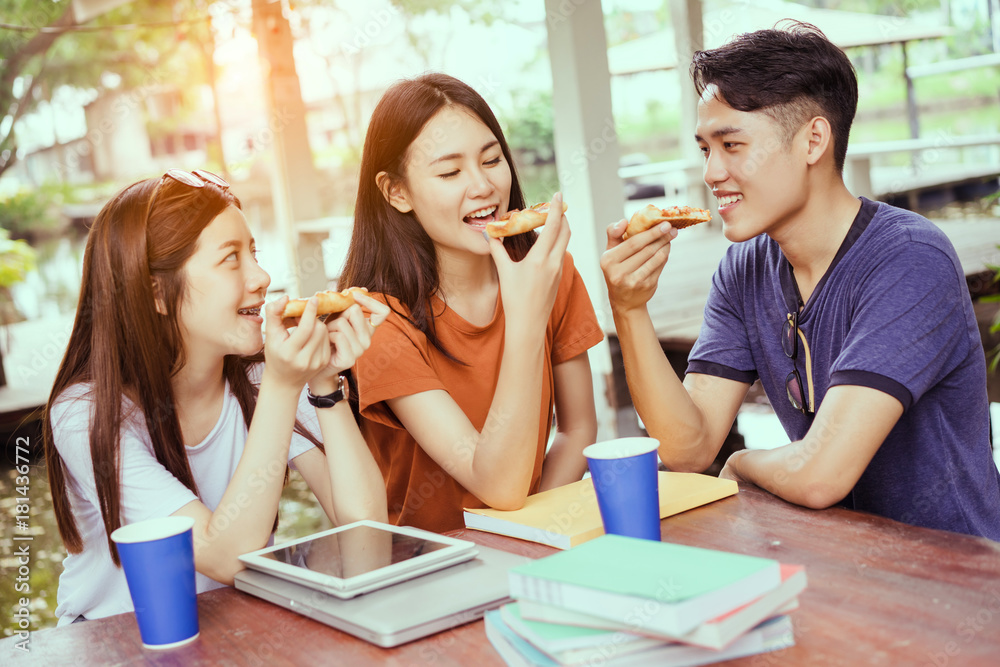 Students asian group together eating pizza in breaking time early next ...