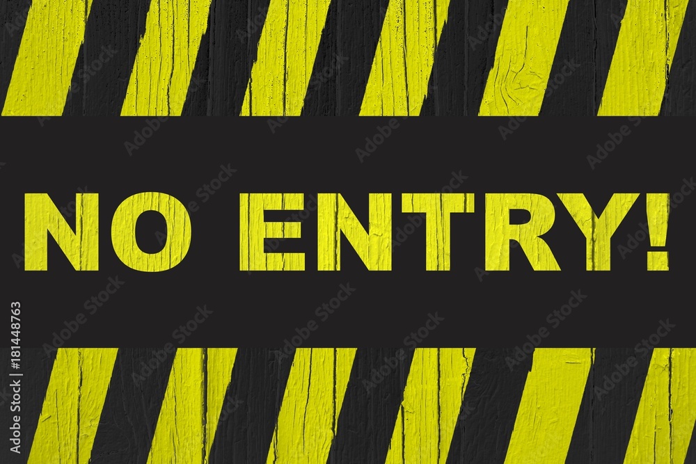 “No Entry!” warning sign with yellow and black stripes painted over ...