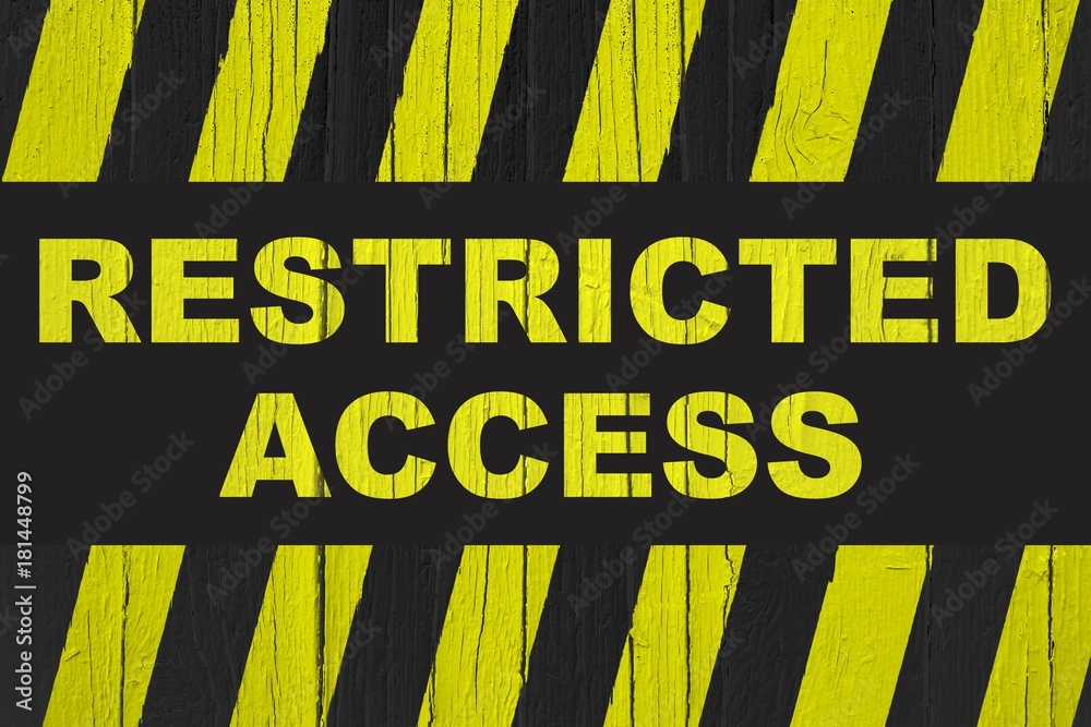 Under construction warning sign with yellow and black stripes painted ...