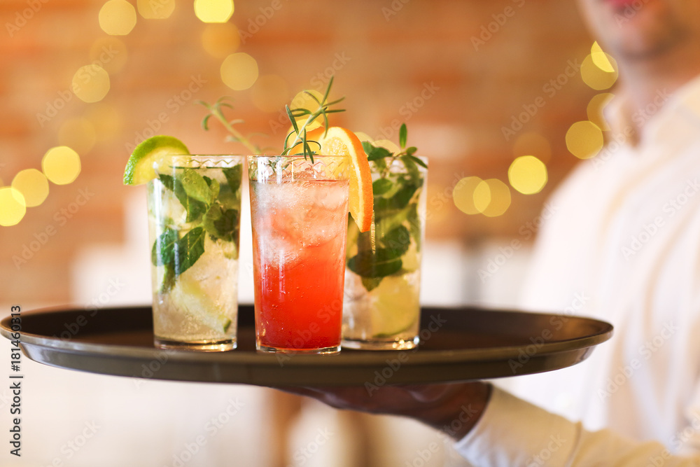 Cocktail glasses on tray in the bar Stock Photo | Adobe Stock