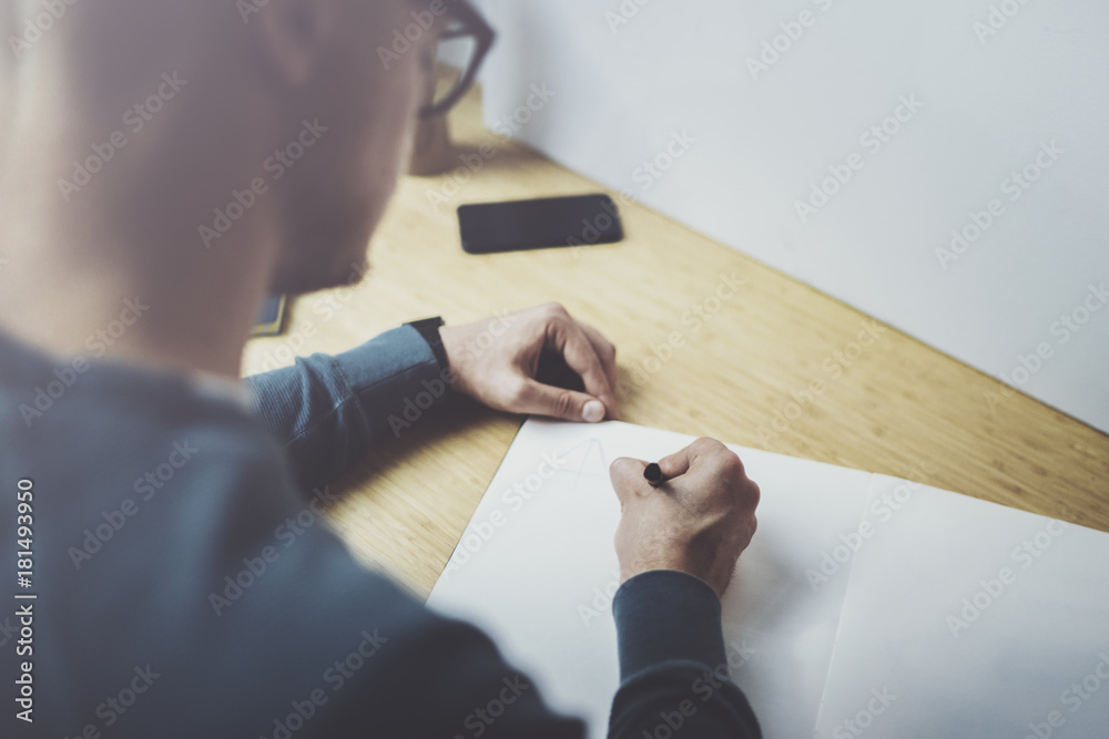 Skilled designer caucasian man drawing abstract sketch with pen.Art ...