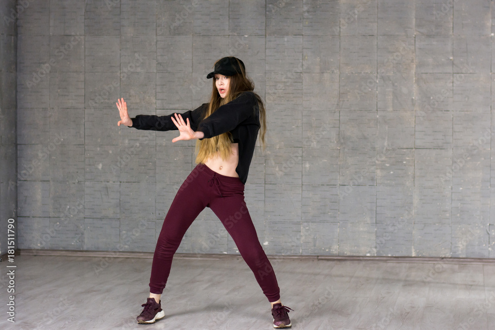 Pretty girl dancing modern dance. Beautiful slim young woman performing ...