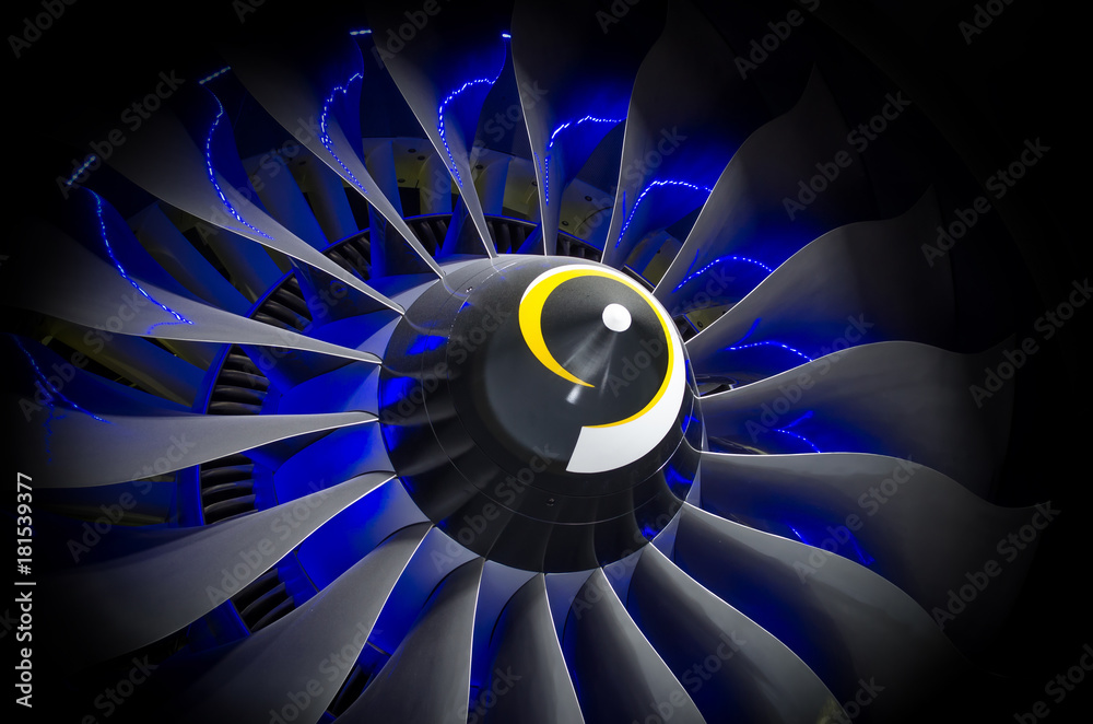 Airplane engine and blades with blue backlight close up black shadow ...