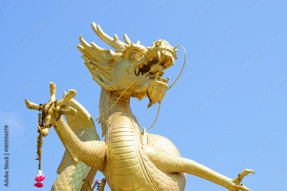 Chinese dragon statue in the mouth with glass balls On the blue sky ...