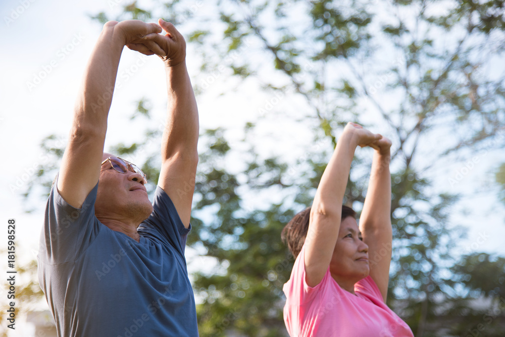 Asian elderly people stretching before exercise. Stock Photo | Adobe Stock