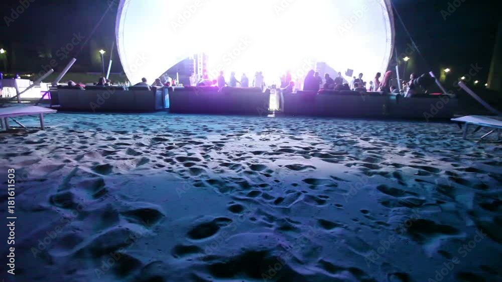 Stage and a disco on the beach. Night Beach Disco with illumination ...