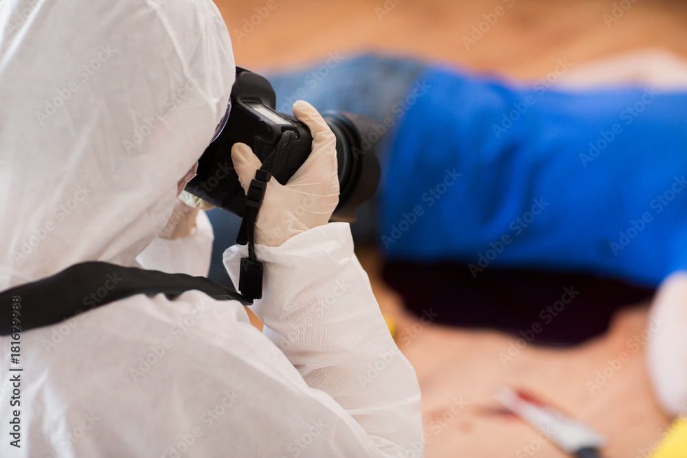 criminalist photographing dead body at crime scene Stock Photo | Adobe ...
