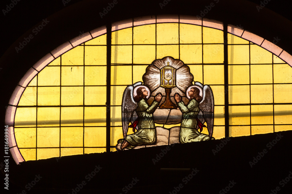 Casorate Primo, Italy. October 26 2017. Stained glass window depicting ...