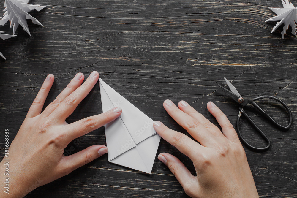 Hands making origami tree Stock Photo | Adobe Stock